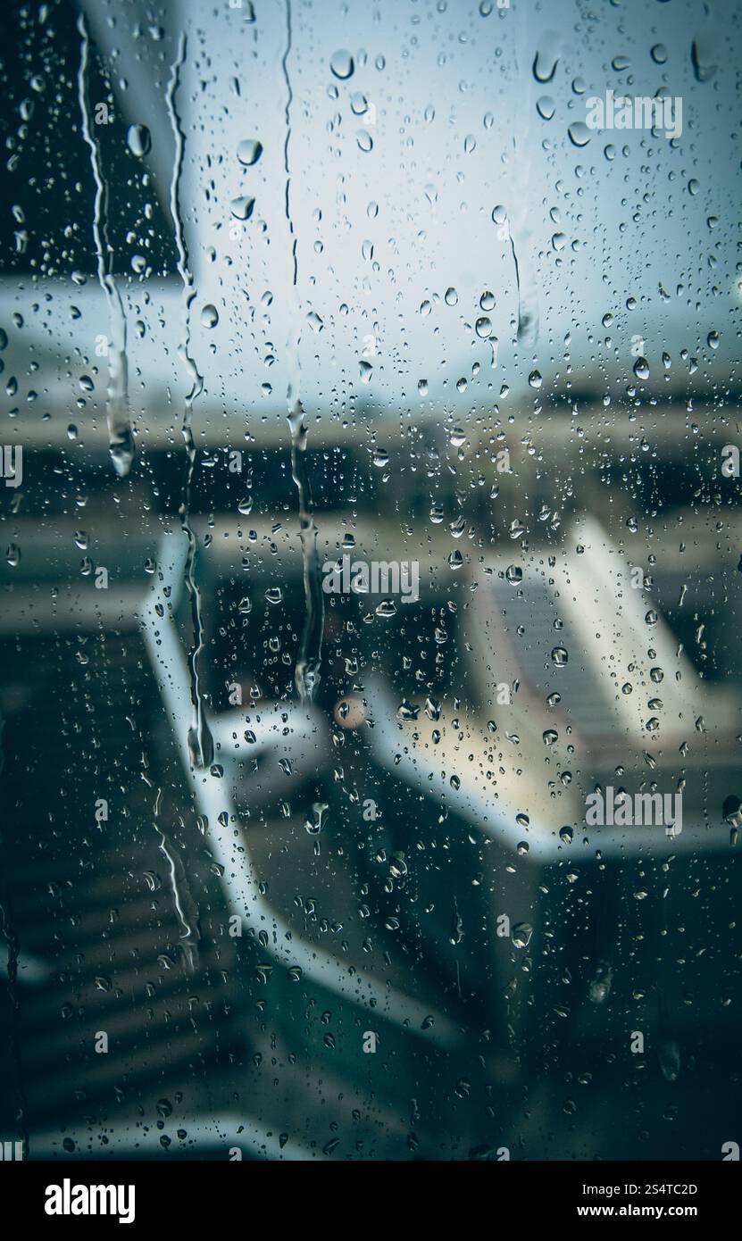 Closeup photo through window with drops at rainy day Stock Photo - Alamy
