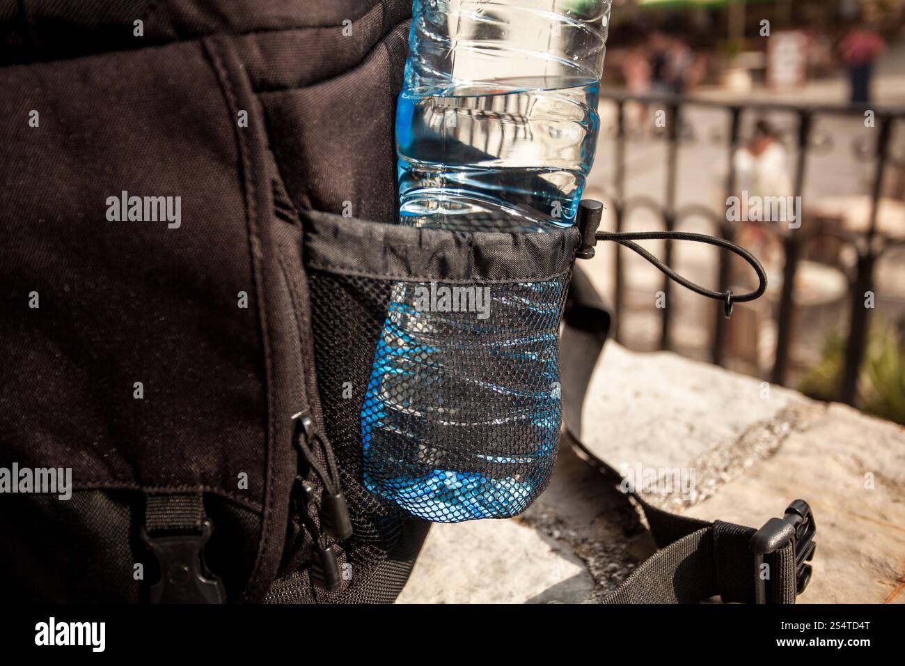 Closeup shot of plastic bottle of water in black backpack Stock Photo ...