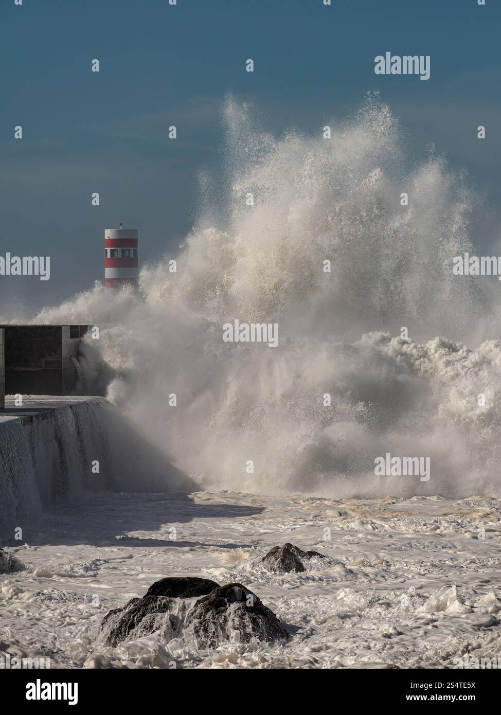 Huge wave splash over a pier and beacon from northern portuguese coast ...