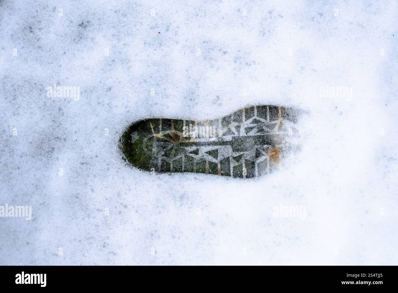High angle view of shoe prints in snow Stock Photo - Alamy