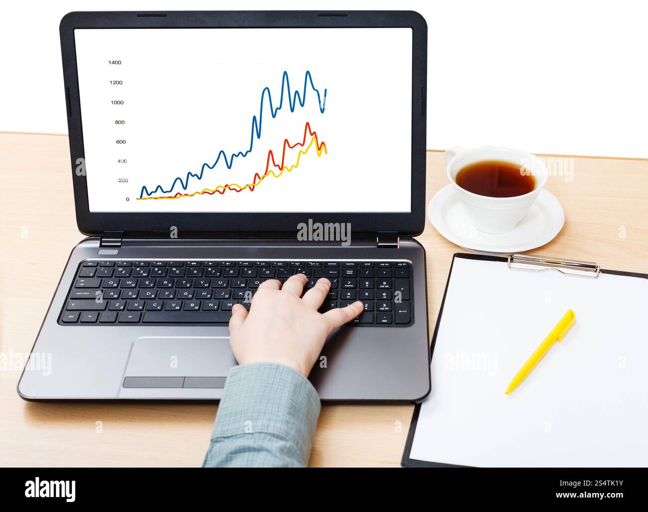 business still life - laptop with graph on screen on office desk ...