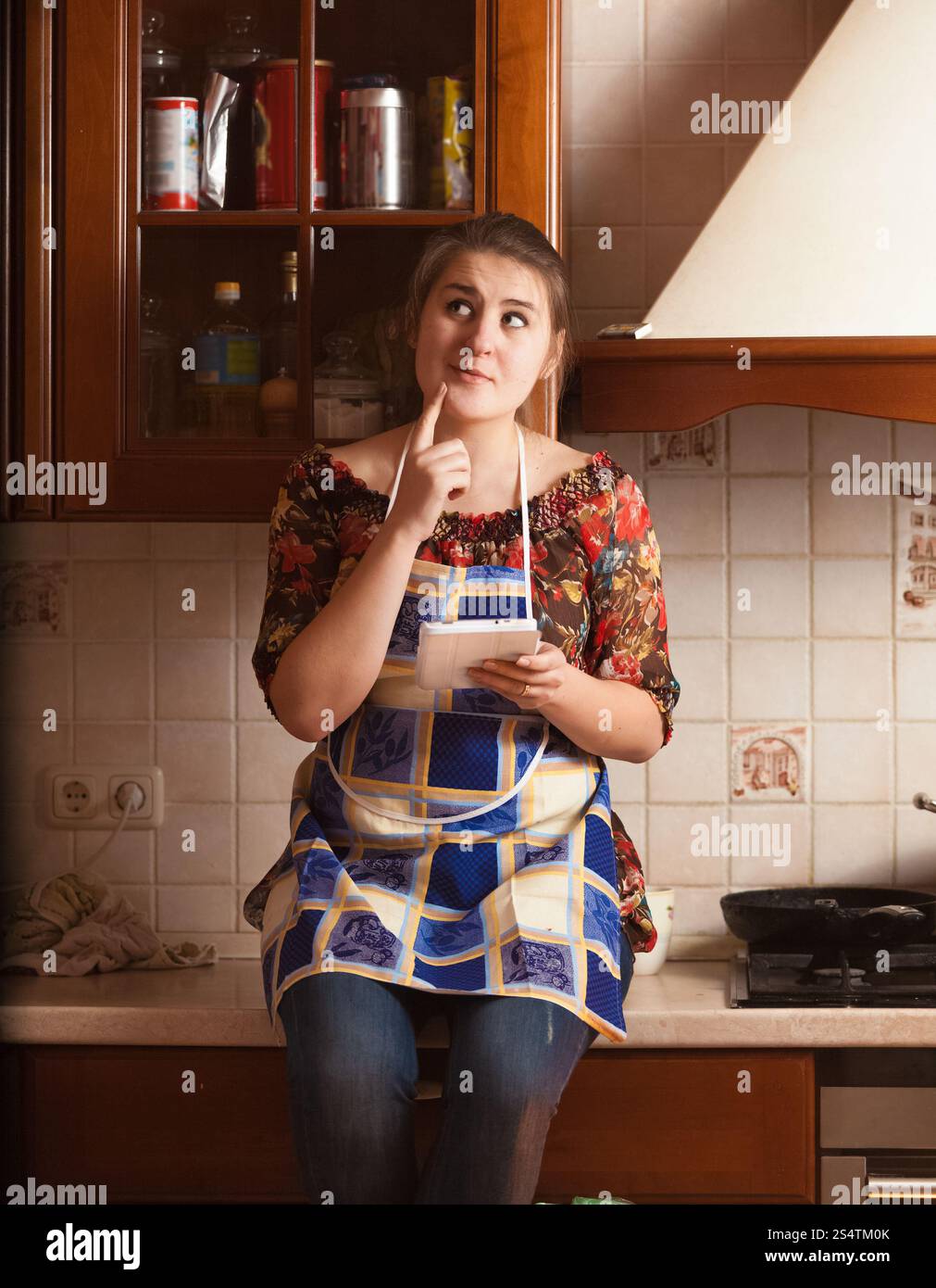 Closeup portrait of housewife remembering recipe of dish Stock Photo ...