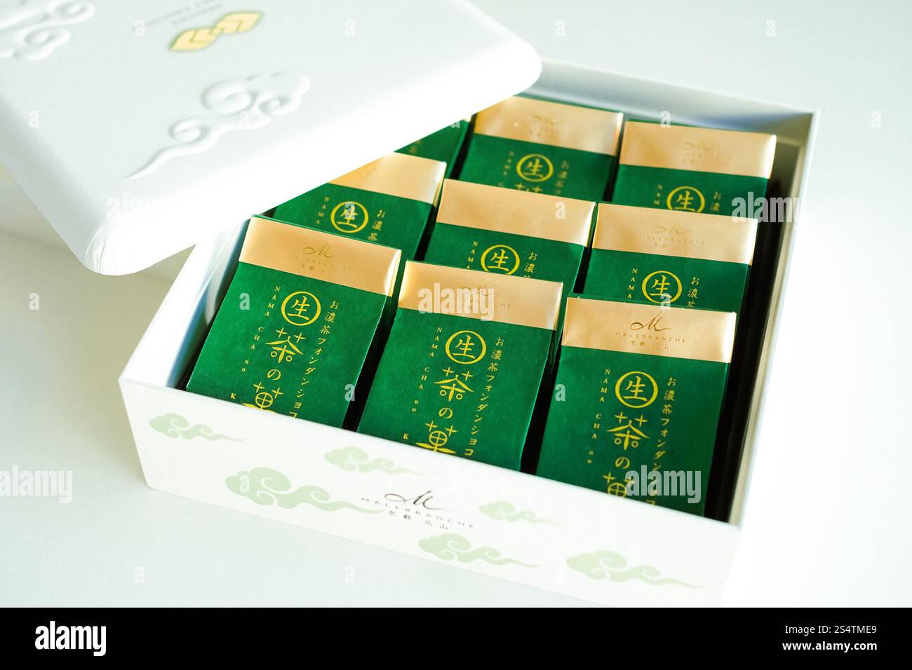 Individual packages of matcha green tea-colored confections from Kyoto ...