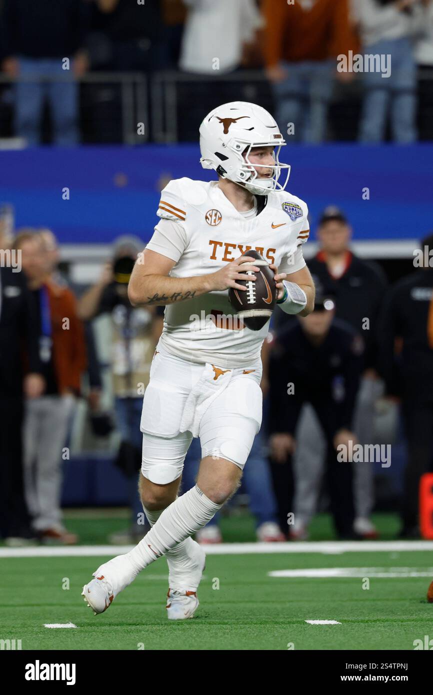Texas quarterback Quinn Ewers (3) looks to pass during the Cotton Bowl ...