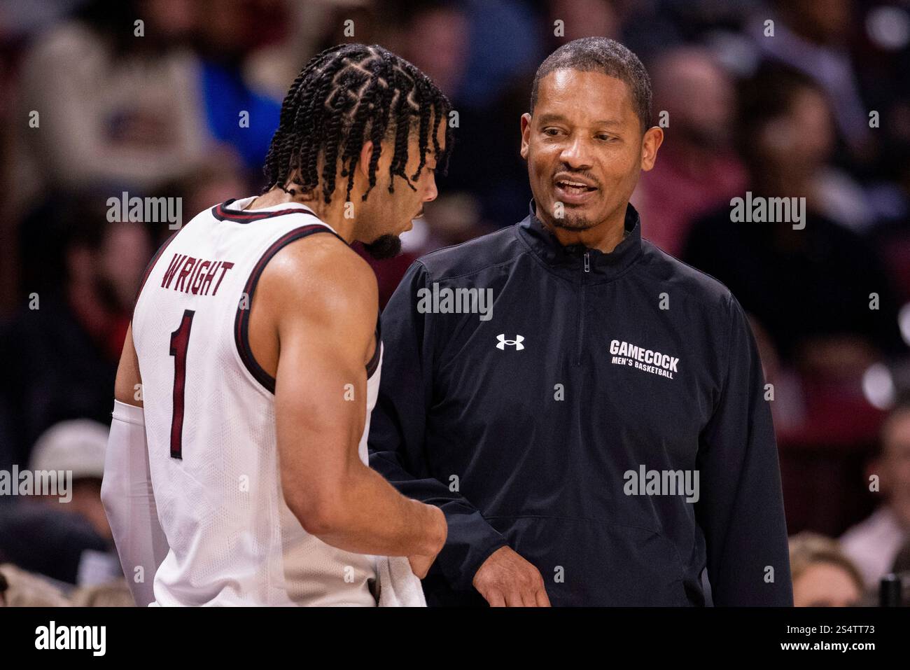 South Carolina head coach Lamont Paris talks to guard Jacobi Wright (1 ...