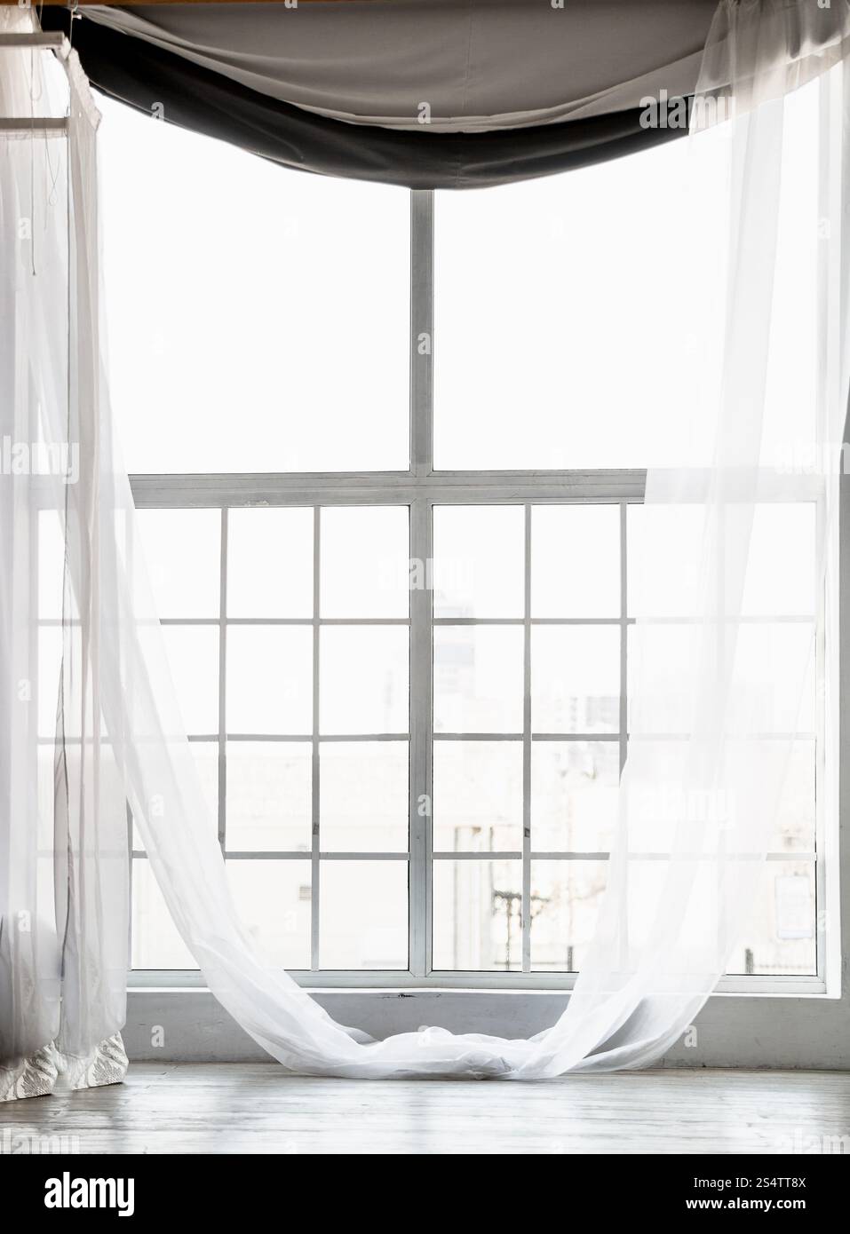Beautiful high window from ceiling to floor with long white curtains ...