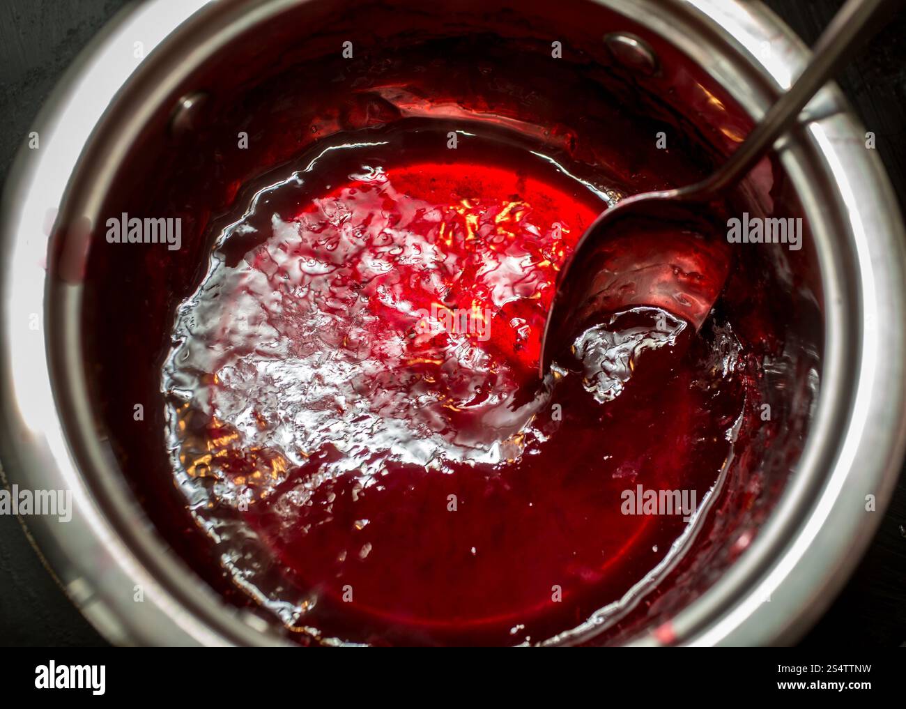 Closeup photo of cooking cherry jam in metal pan Stock Photo - Alamy