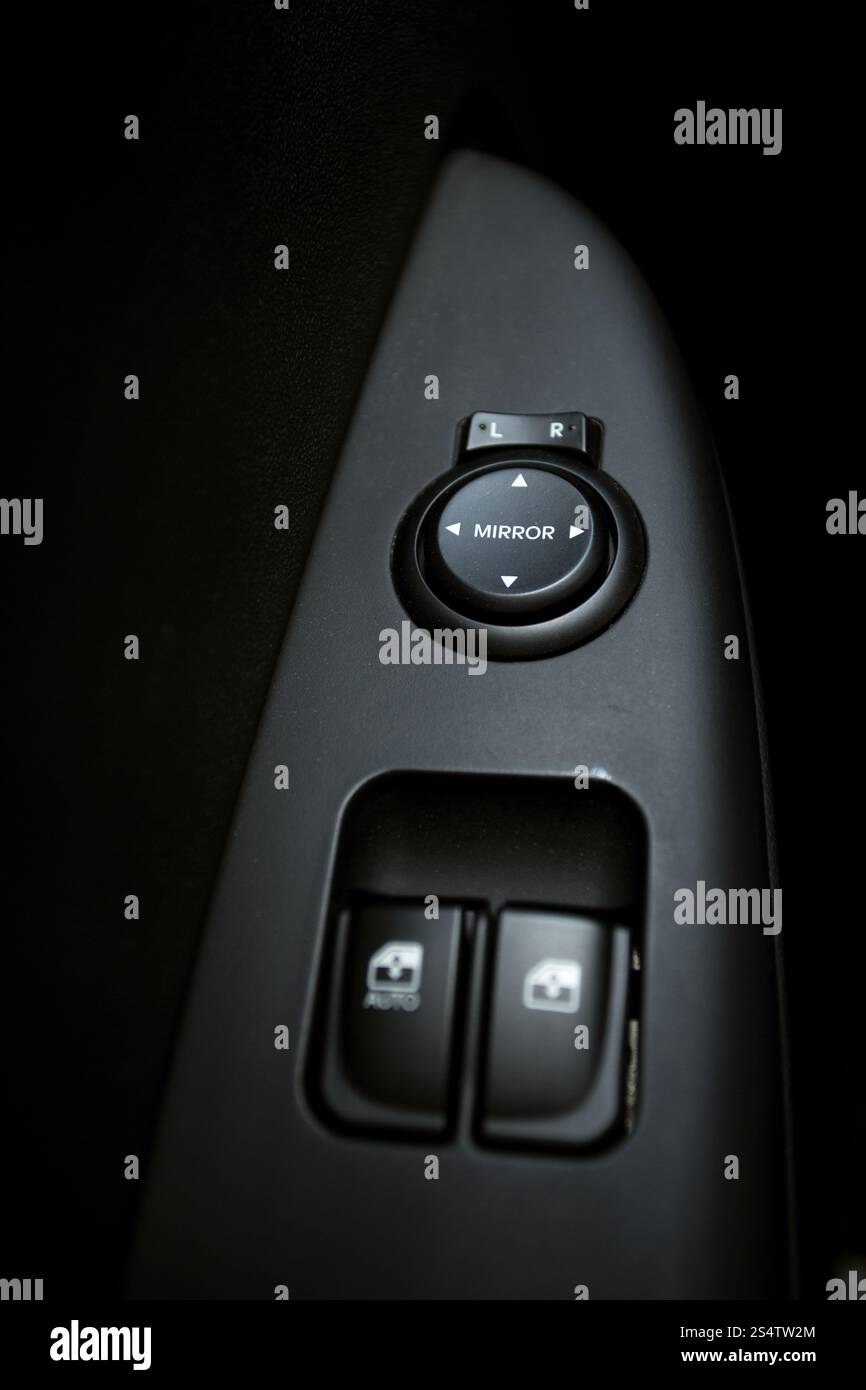 Closeup photo of knobs controlling windows and mirrors in car Stock ...