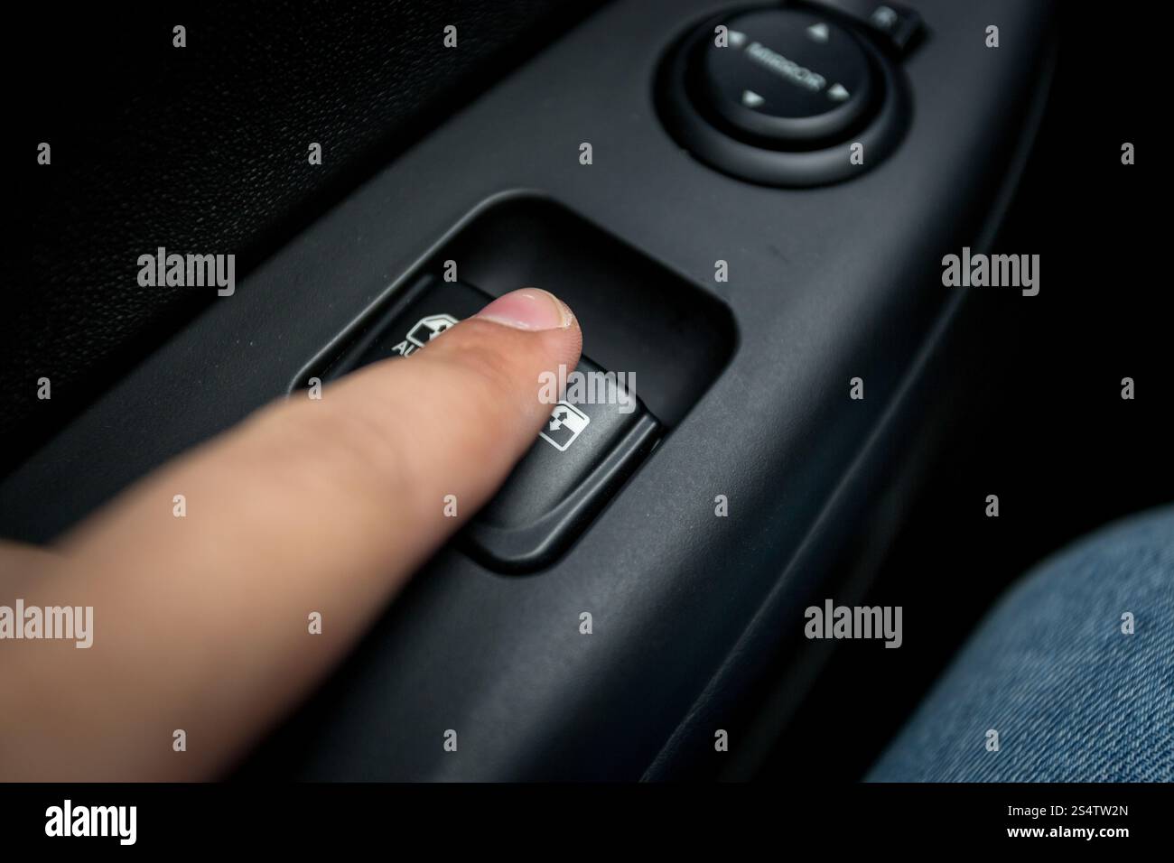 Closeup photo of man pressing button controlling window in car Stock ...