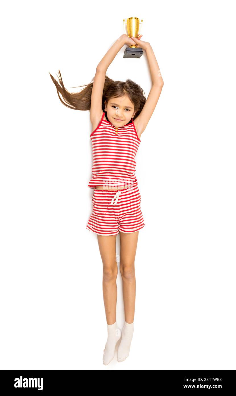 Isolated photo of beautiful smiling girl holding trophy cup over head ...