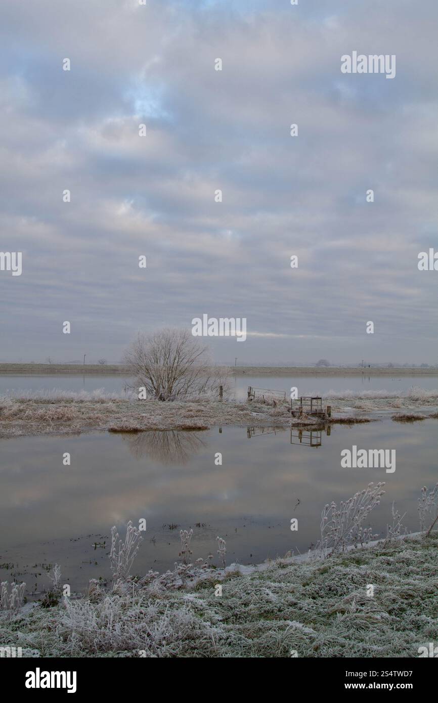Frozen sluice gate on the flooded New Bedford River, part of the Ouse ...