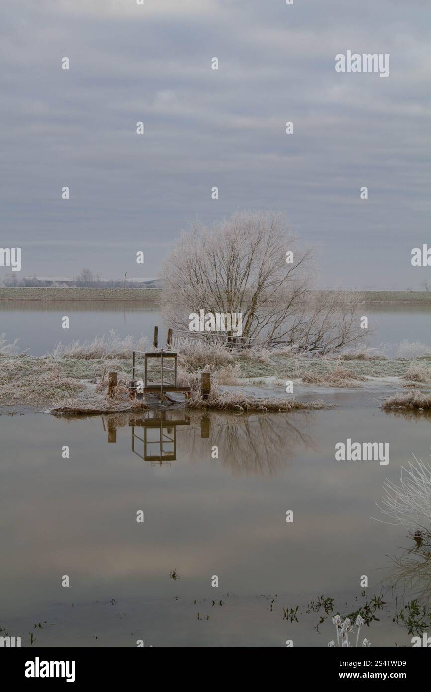 Frozen sluice gate on the flooded New Bedford River, part of the Ouse ...