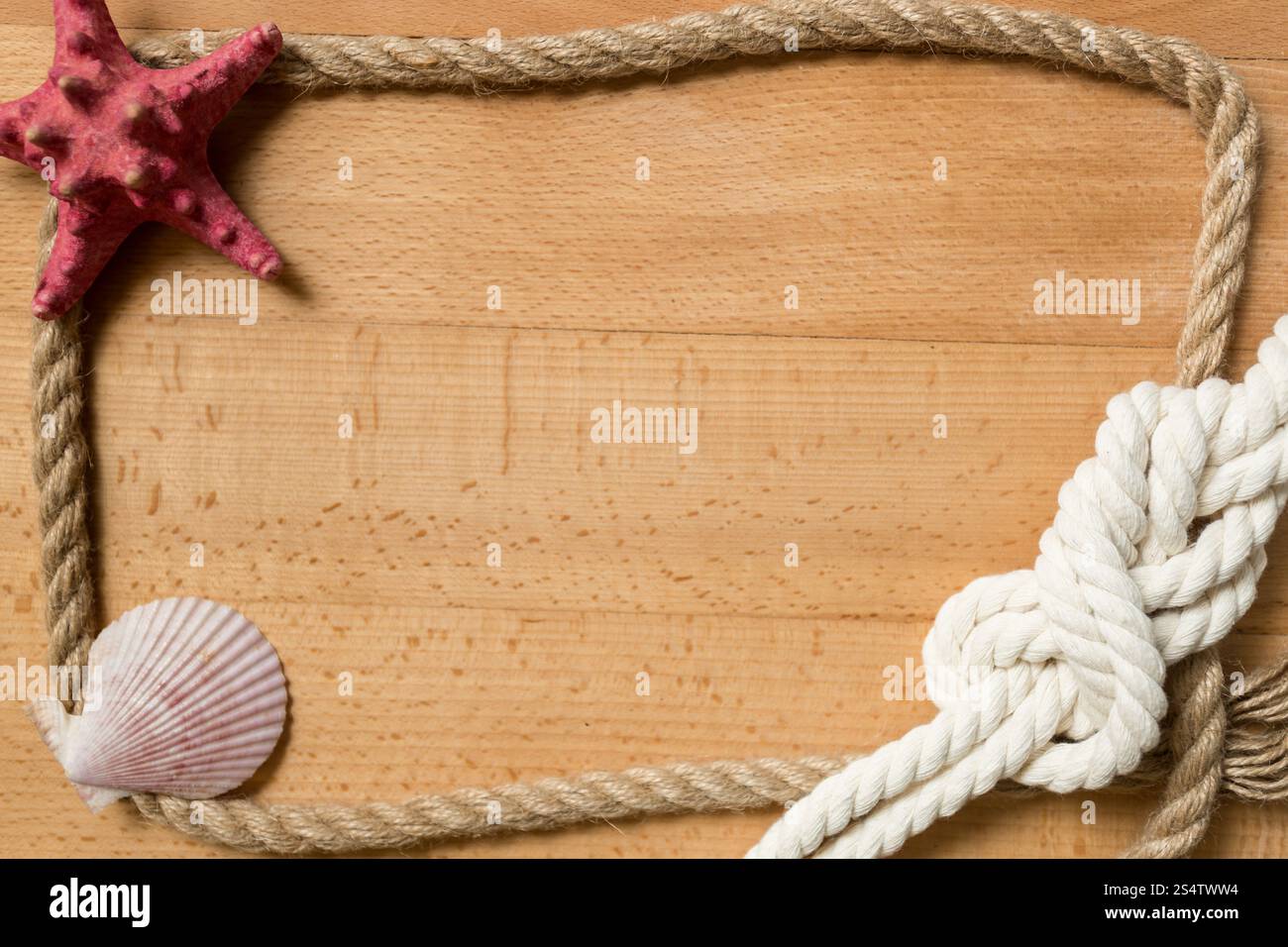 Old wooden boards with rope frame decorated by marine knot and ...