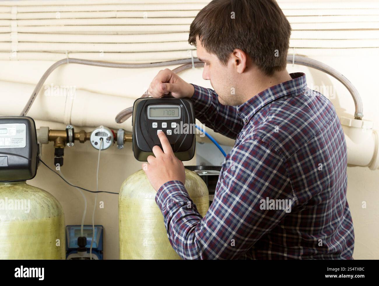 Portrait of engineer checking pressure meters at factory Stock Photo ...