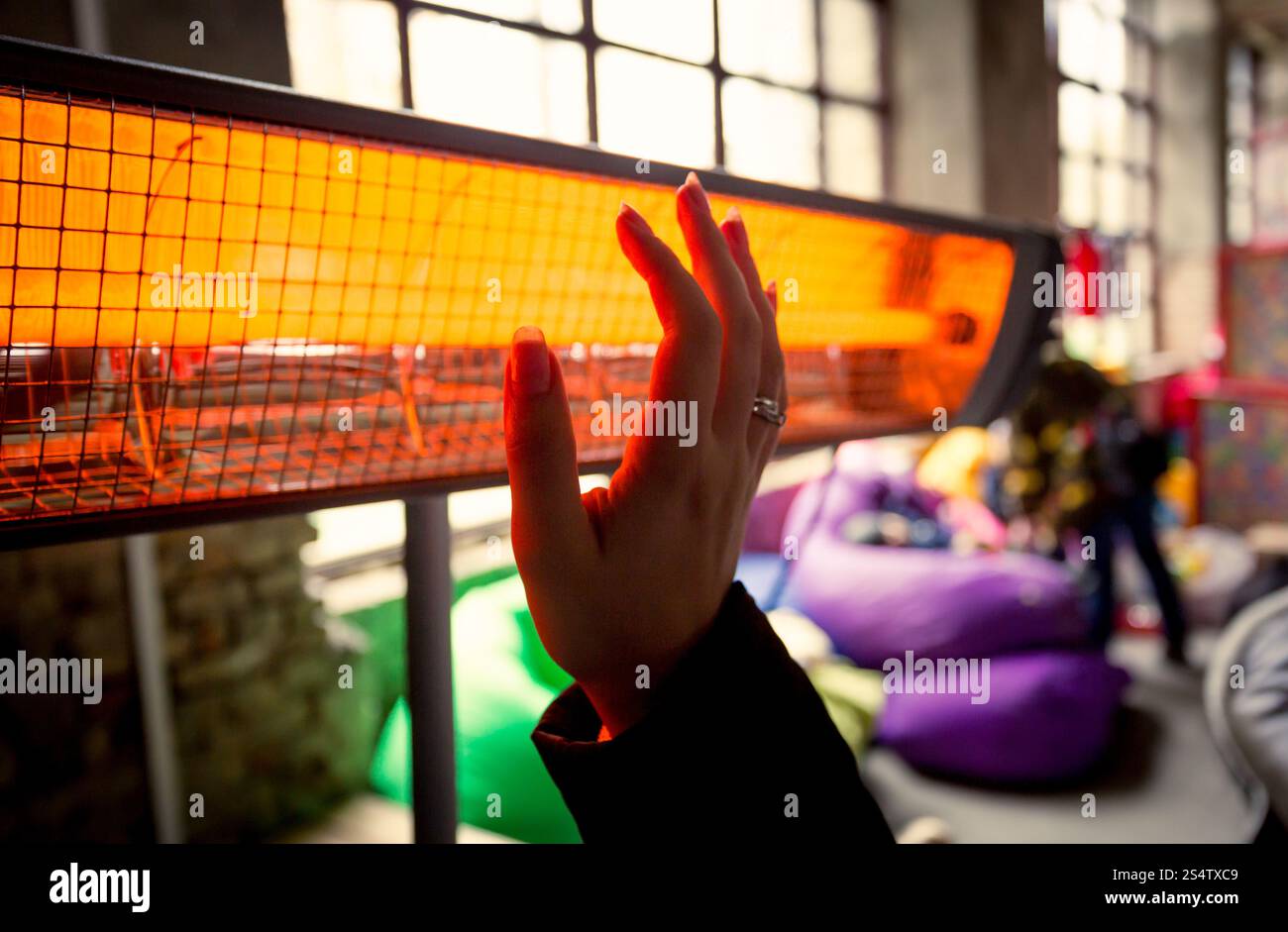 Woman energy heater hi-res stock photography and images - Alamy