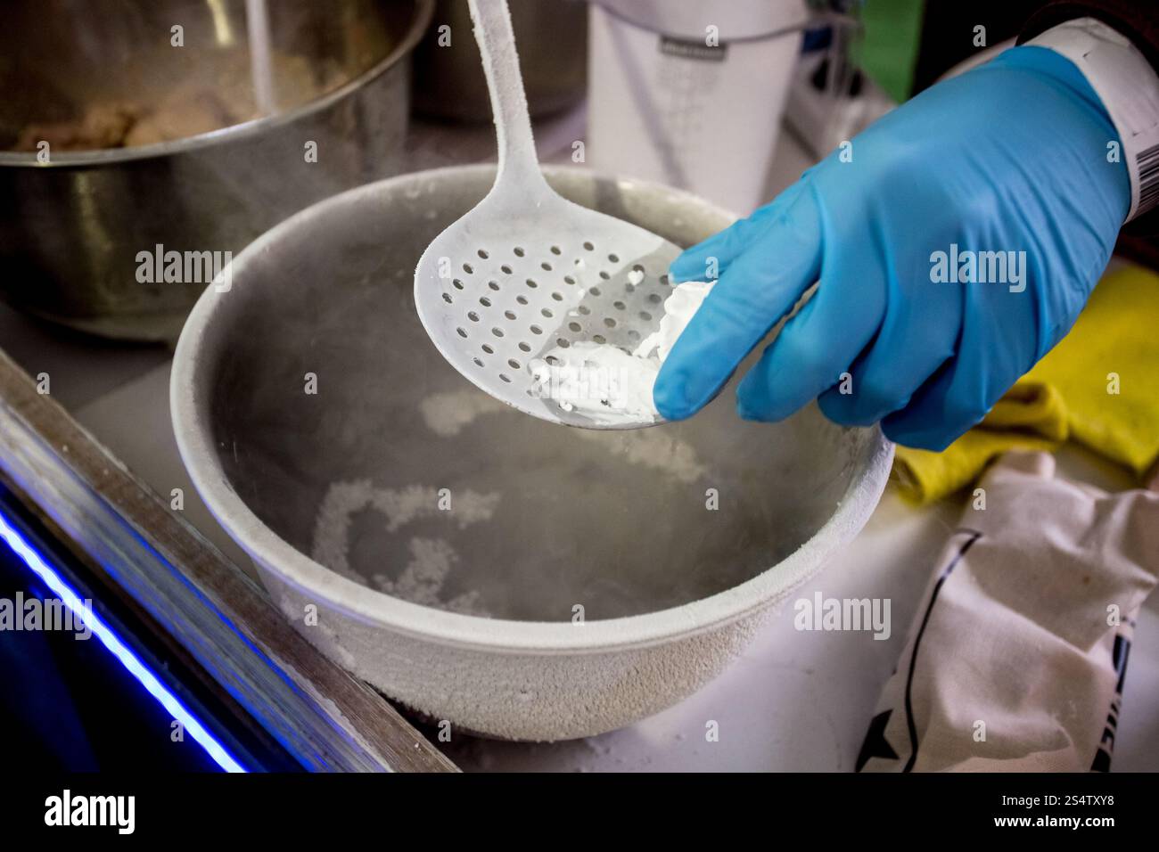 Closeup shot of chef making ice cream using liquid nitrogen Stock Photo ...