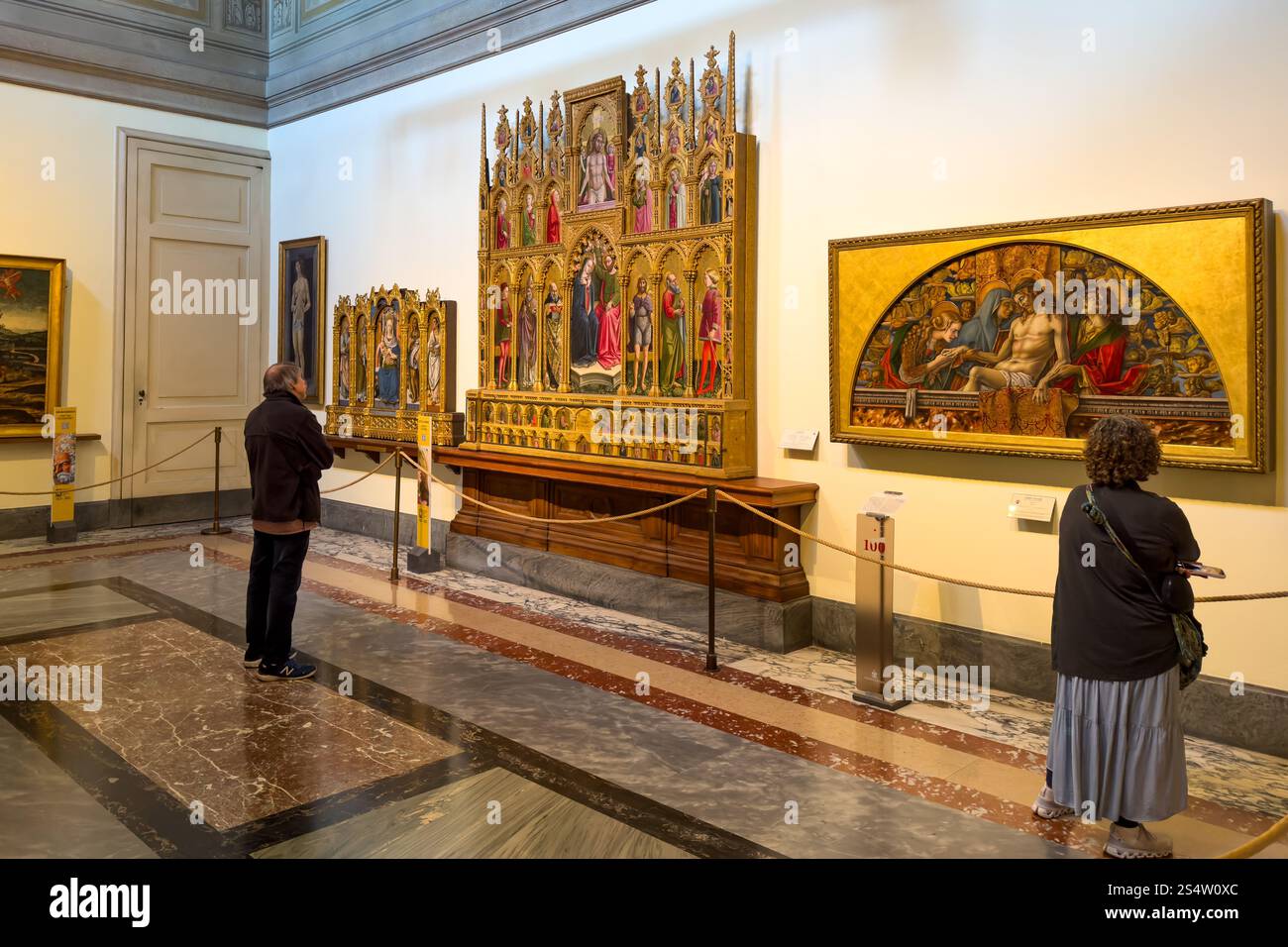 Visitors view religious paintings in the Pinacoteca, Vatican Museums ...
