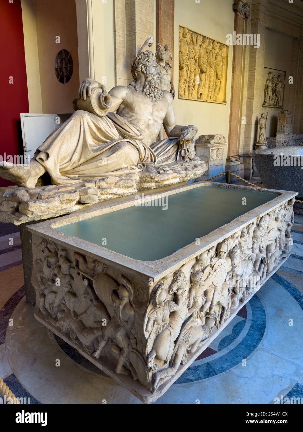 Ornately carved Roman sarcophagus with statue of Arno in the Vatican ...