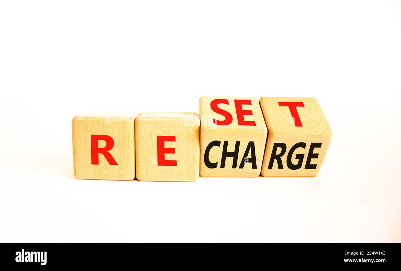 Reset and recharge symbol. Concept words Reset Recharge on beautiful wooden block. Beautiful ...
