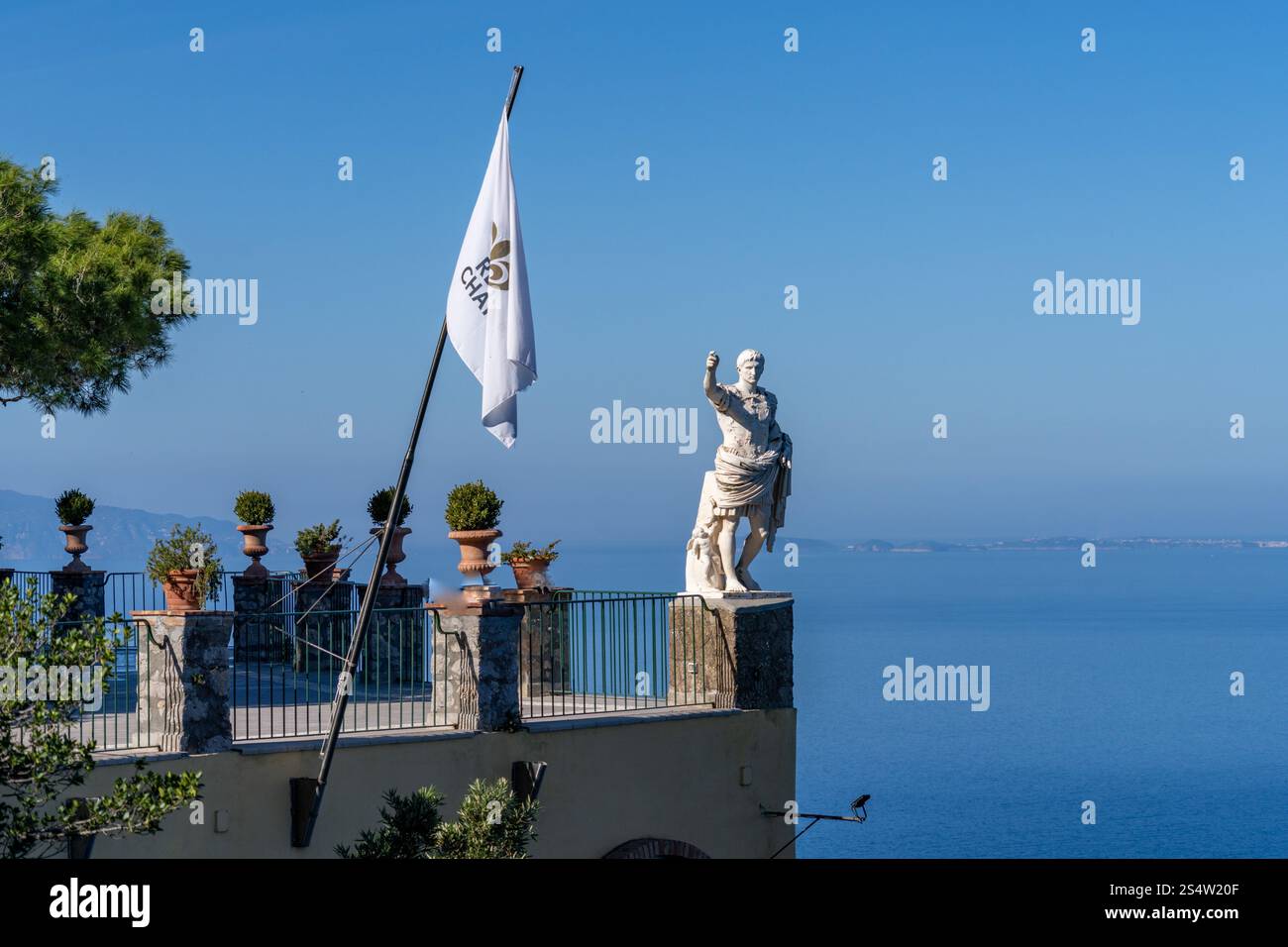 A statue of Augustus Caesar on a cliff-top patio at the Hotel Augustus ...