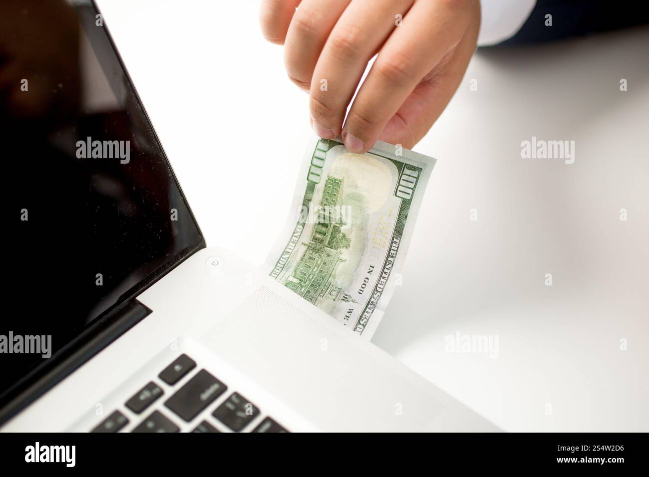 Conceptual photo of digital money transfer. Man inserting dollar ...