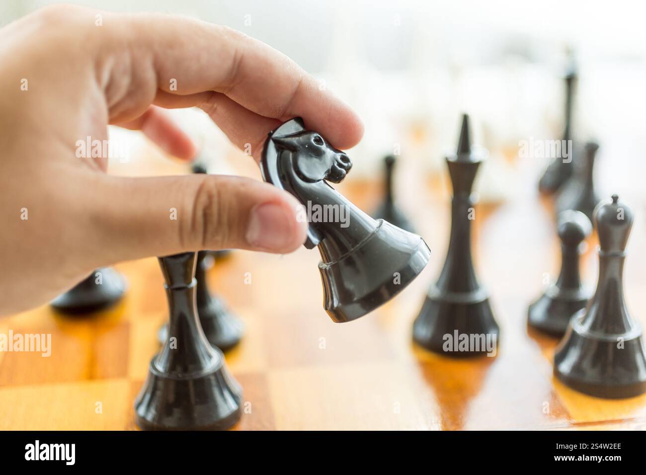 Hand placing chess piece hi-res stock photography and images - Alamy