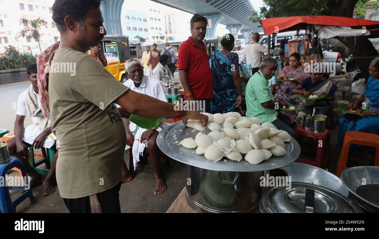 India, Tamil Nadu, Tirupathi, Idli rice cakes being cooked in the ...