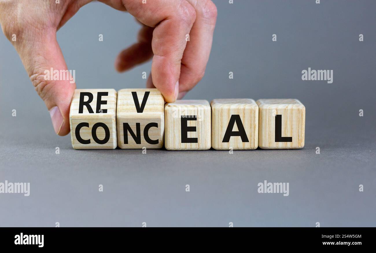 Reveal or conceal symbol. Businessman turns wooden cubes and changes ...