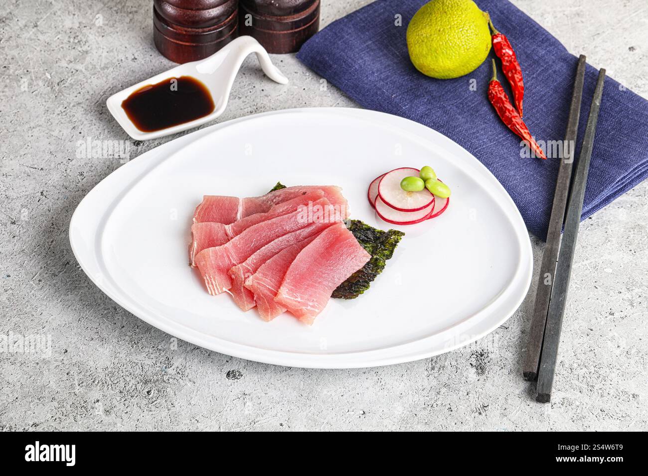Japanese cuisine - sliced raw tuna sashimi Stock Photo - Alamy