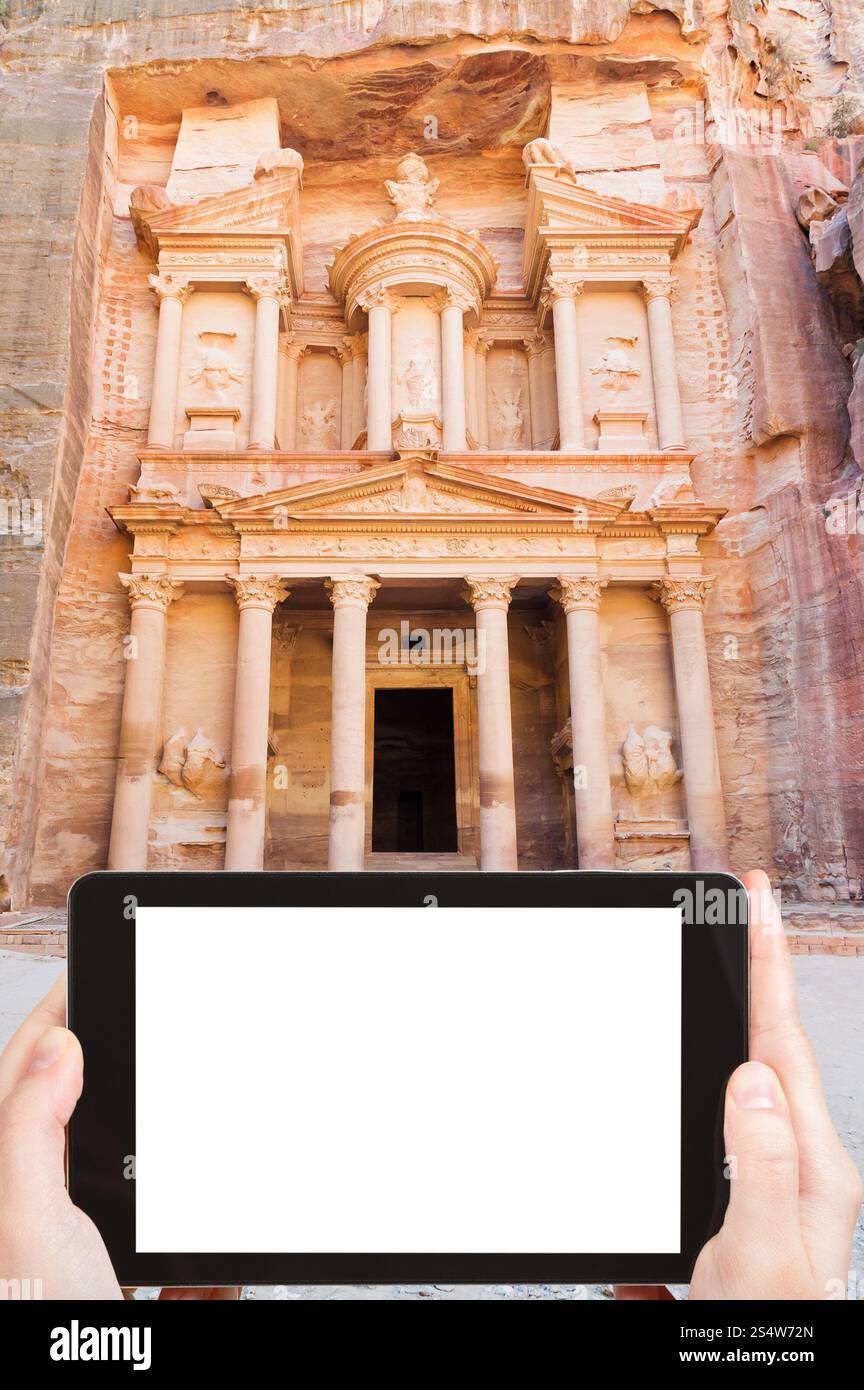 travel concept - tourist photograph symbol of ancient town Petra ...