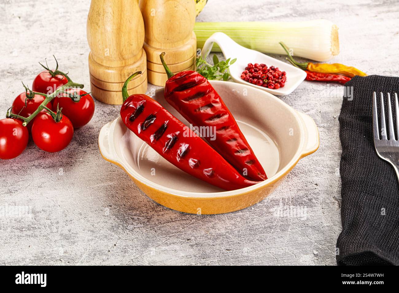 Grilled red spicy pepper snack in the bowl Stock Photo - Alamy