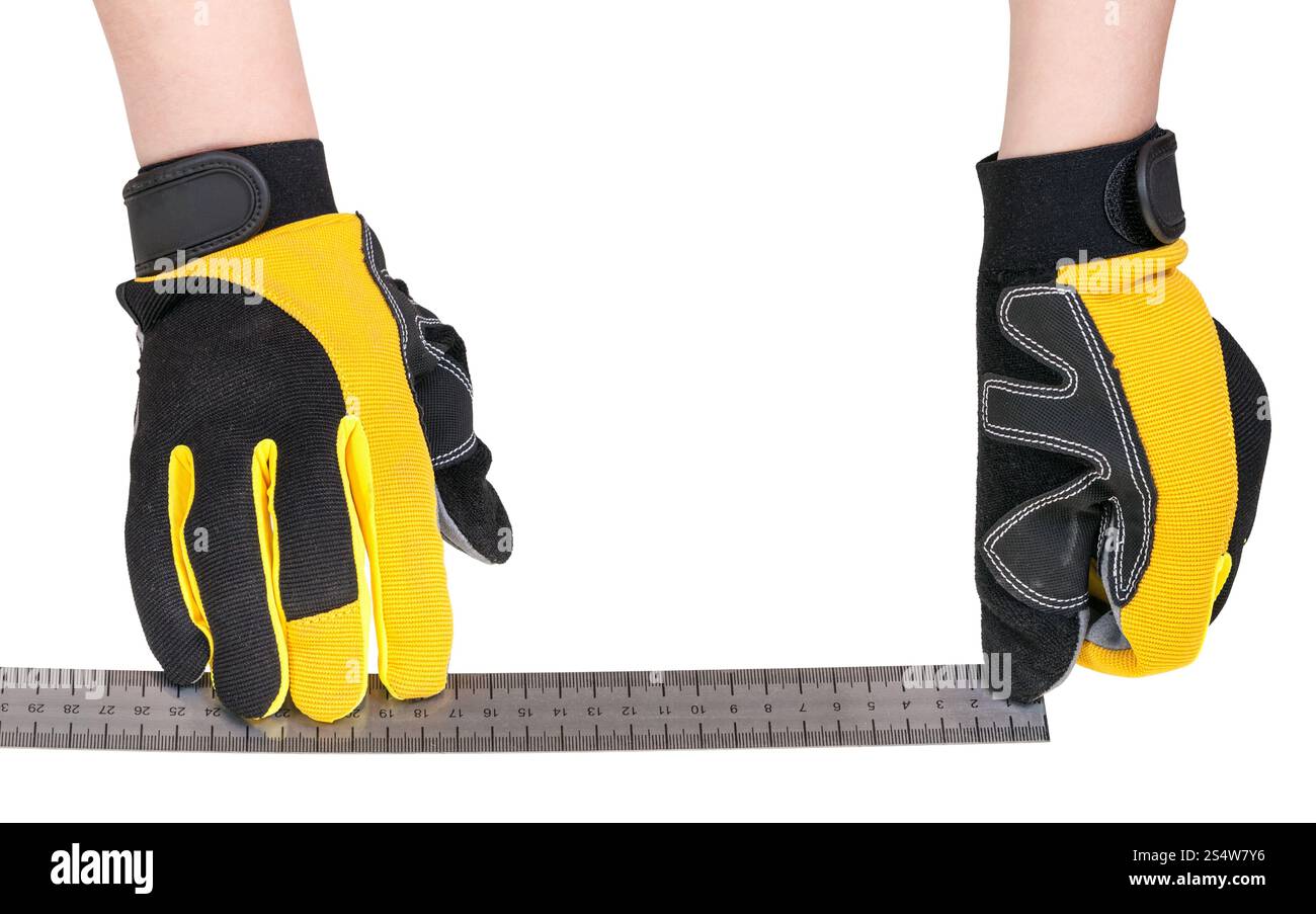 worker hands in safety gloves with ruler isolated on white background ...