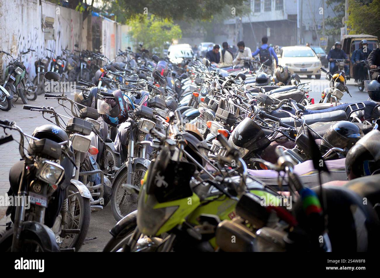 View of illegal encroachment by parking on a road by influent parking ...