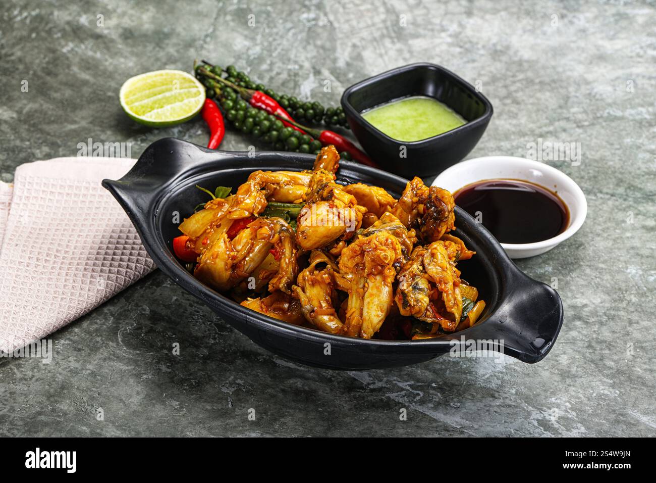 Vietnamese cuisine - fried frog with vegetables and spices Stock Photo ...