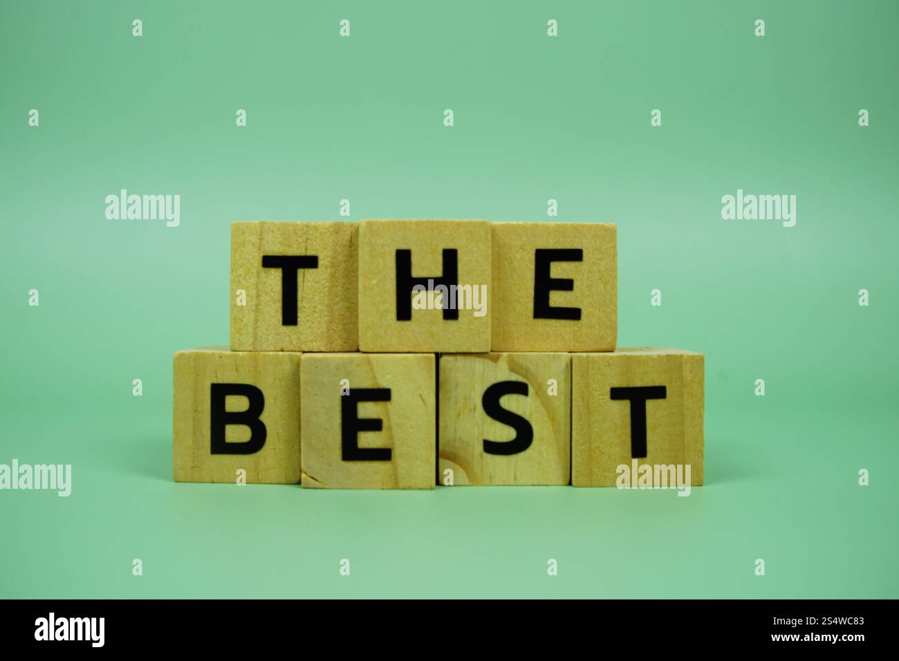 The Best with wooden blocks alphabet letters on green background Stock ...