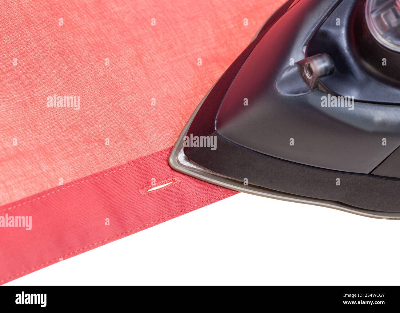 clothing iron ironing red shirt close up isolated on white background ...