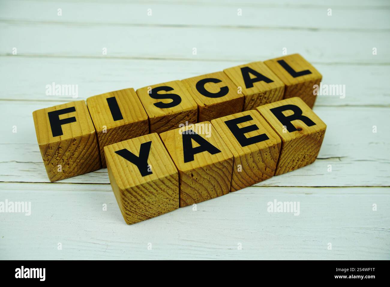 Fiscal Year with wooden blocks alphabet letters on wooden background ...