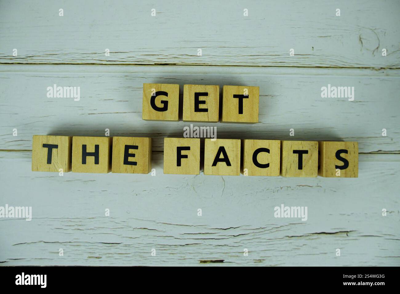 Get The Facts with wooden blocks alphabet letters on wooden background ...