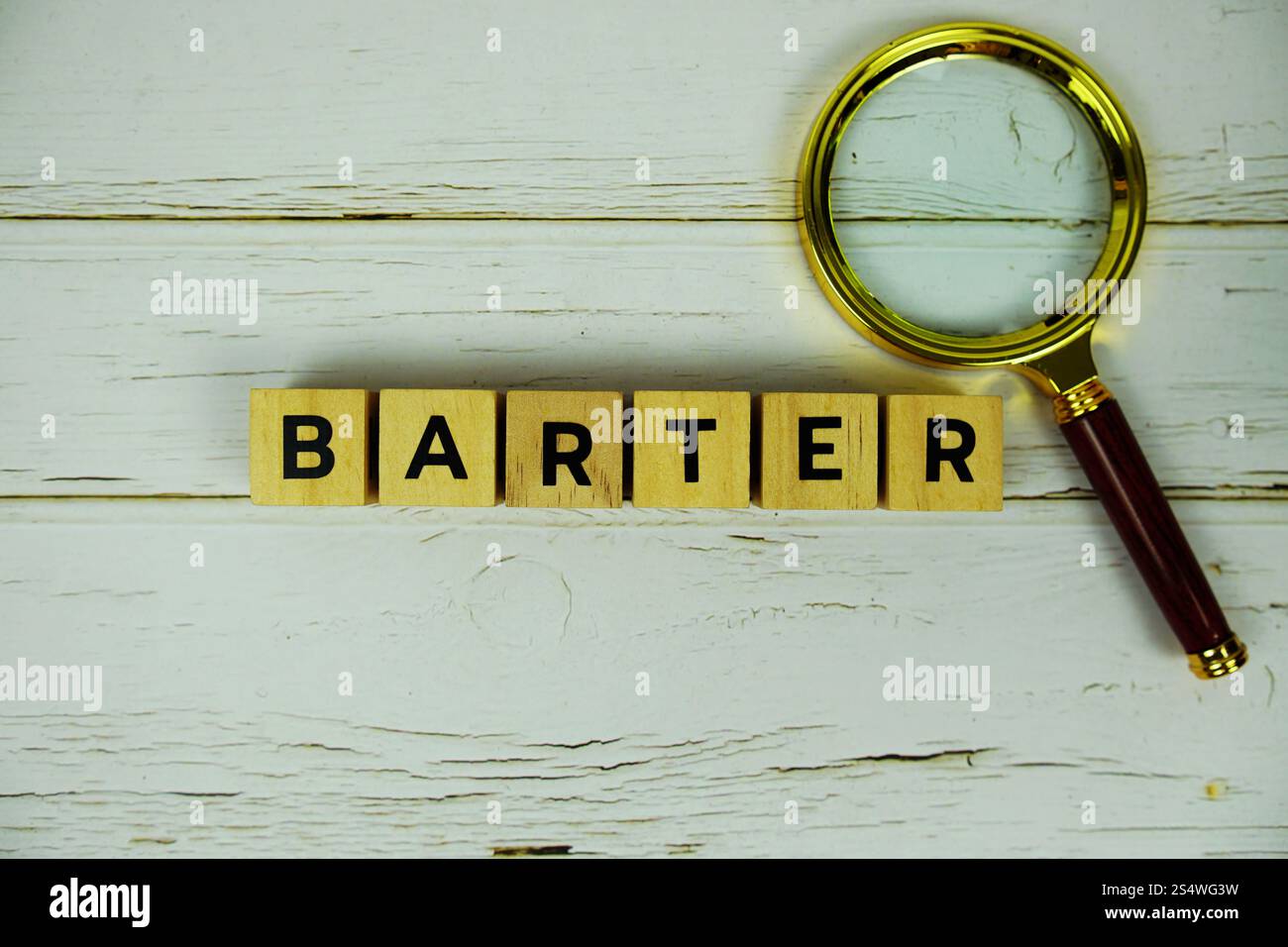 Barter with wooden blocks alphabet letters and magnifying glass on ...