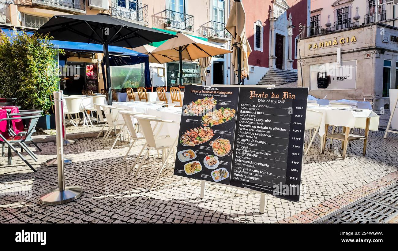Outdoor restaurant menu displaying various dishes and prices in Lisbon ...