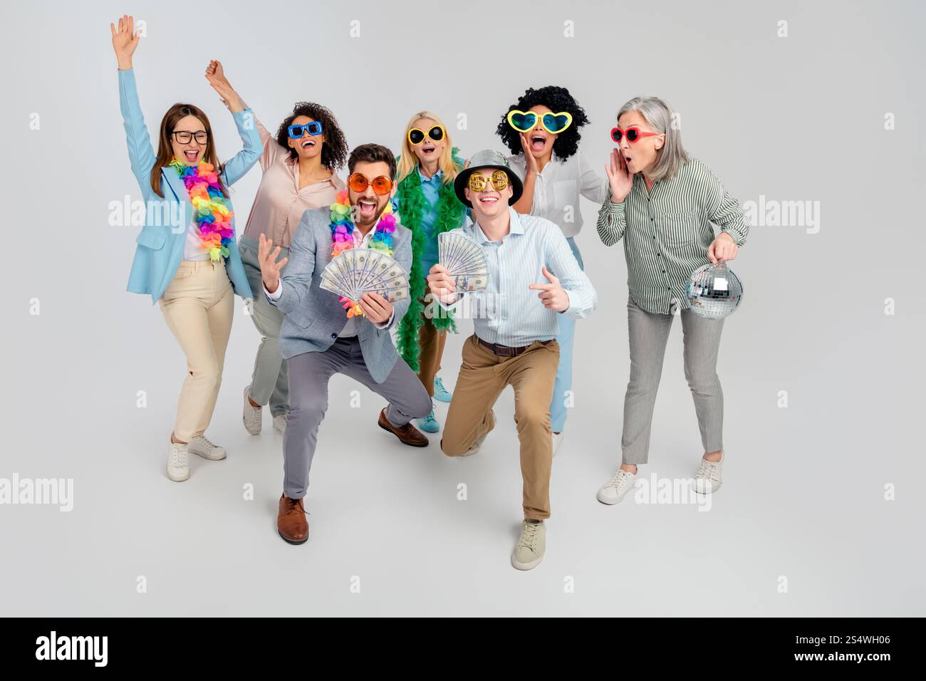 Group of diverse colleagues celebrating success together in a vibrant ...