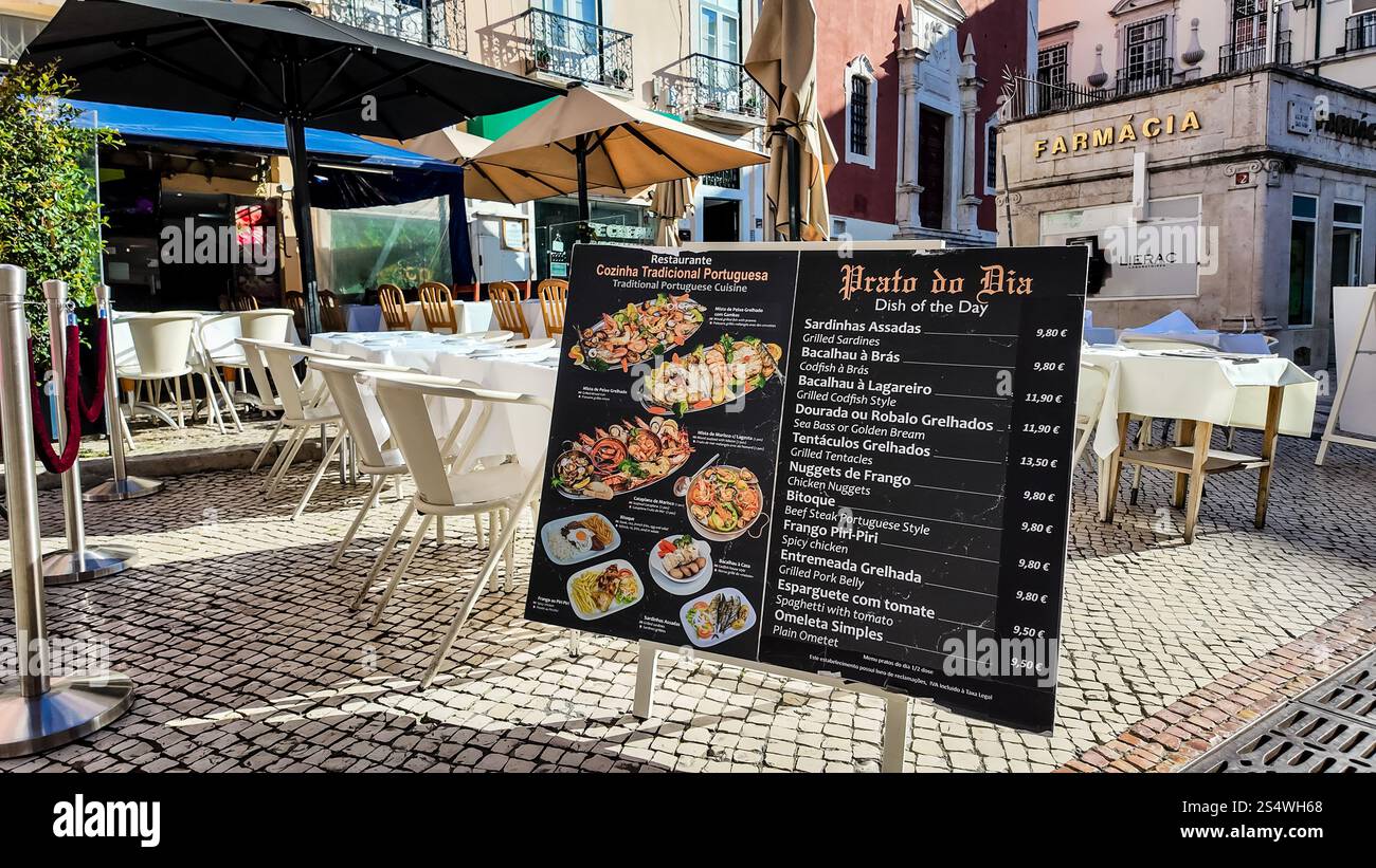 Outdoor restaurant menu displaying various dishes and prices in Lisbon ...