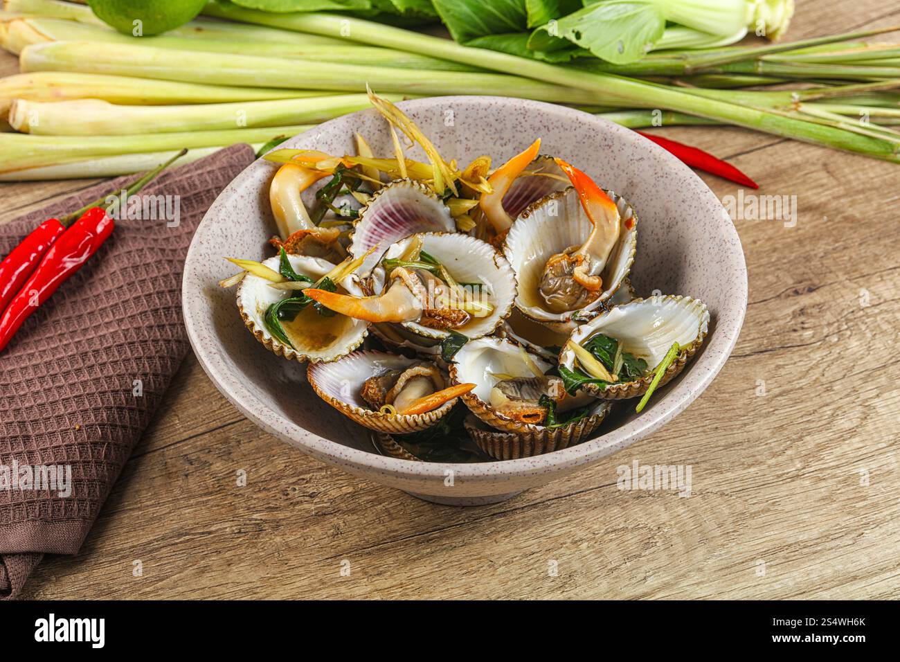 Delicous Asian mollusk shell steamed with spices Stock Photo - Alamy