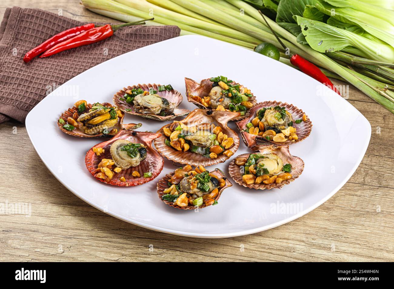 Baked scallops with scalion oil and green onion Stock Photo - Alamy