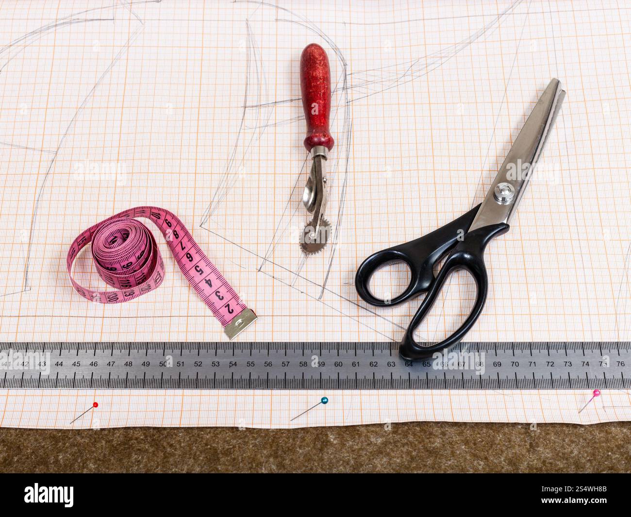 dressmaking still life - top view of cutting table with textile ...