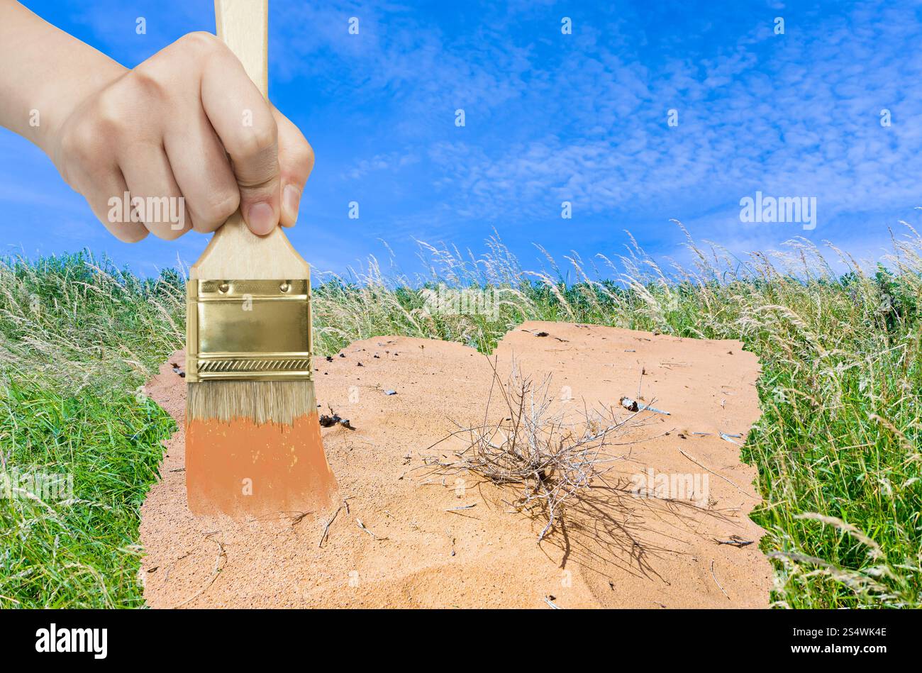 nature concept - seasons and weather changing: hand with paintbrush paints sand in green meadow ...