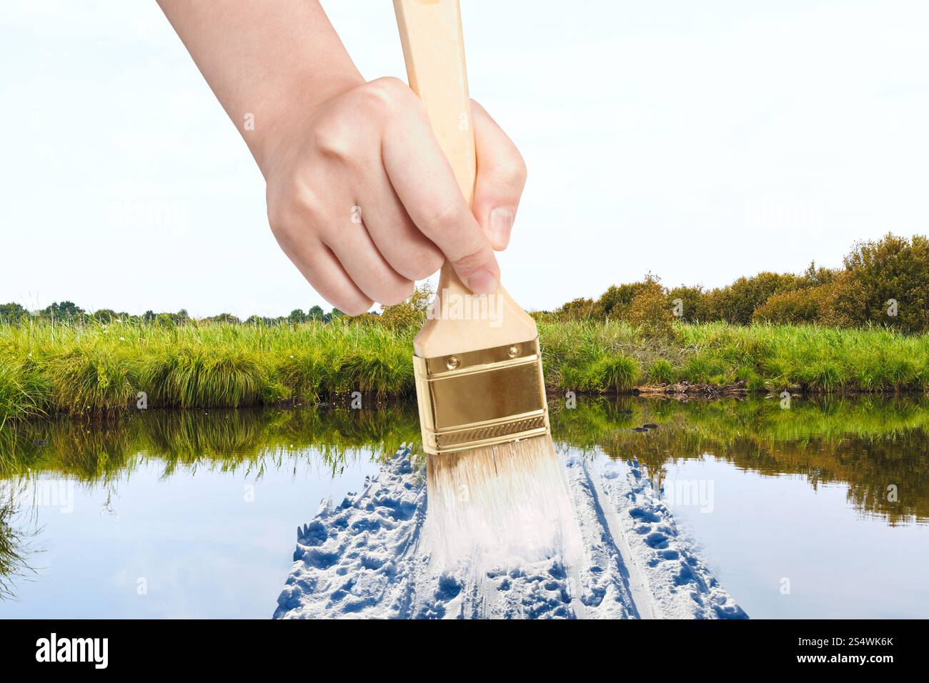 nature concept - seasons and weather changing - hand with paintbrush ...