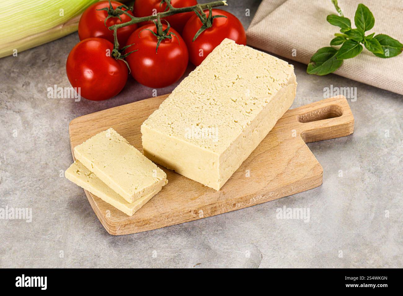Soya vegan tofu cheese brick over board Stock Photo - Alamy