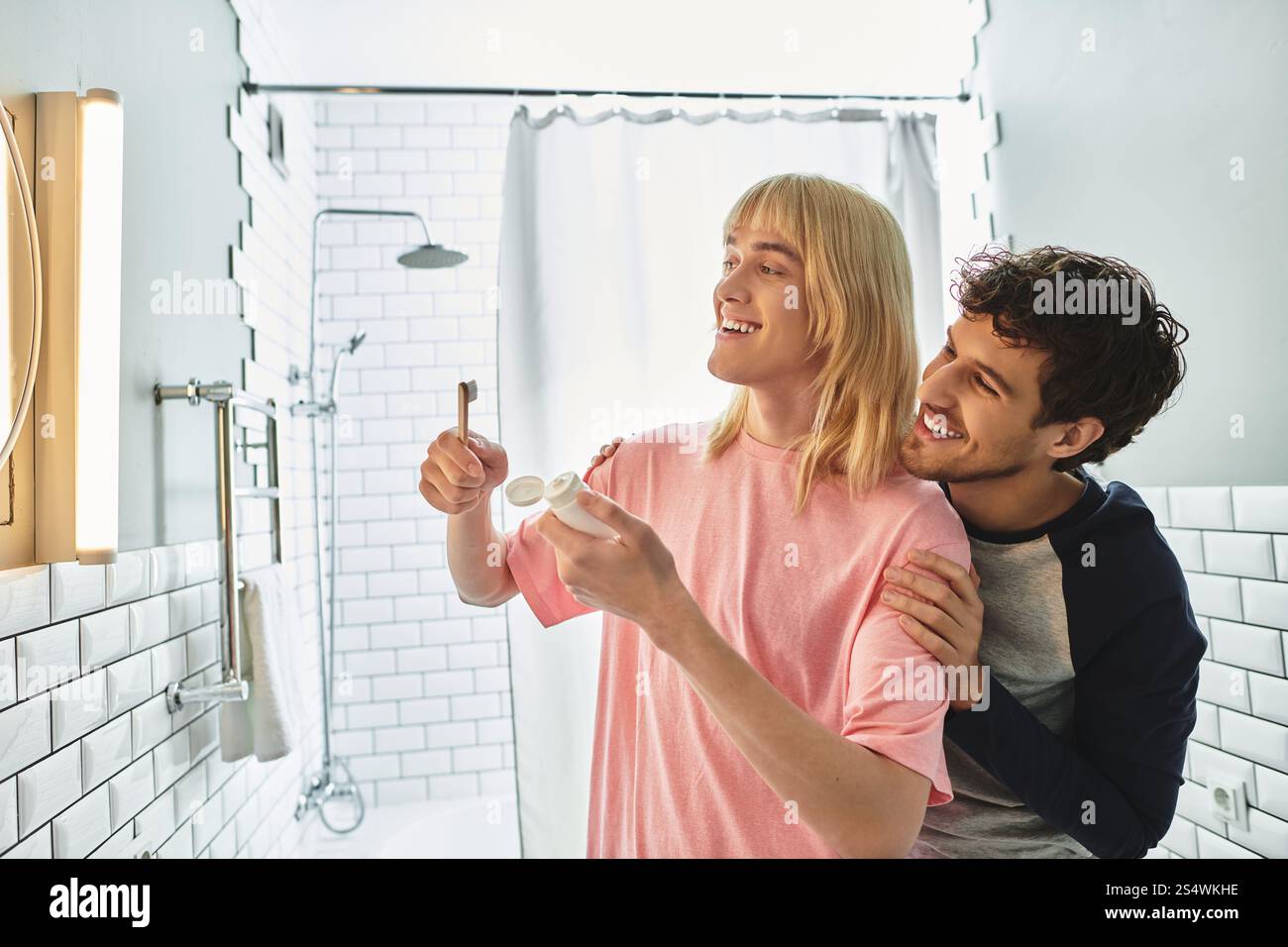 Two men embrace warmly while enjoying their morning routine in a ...