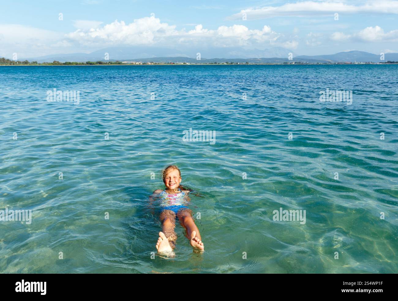 Happy girl in sea clean water lefkada hi-res stock photography and ...